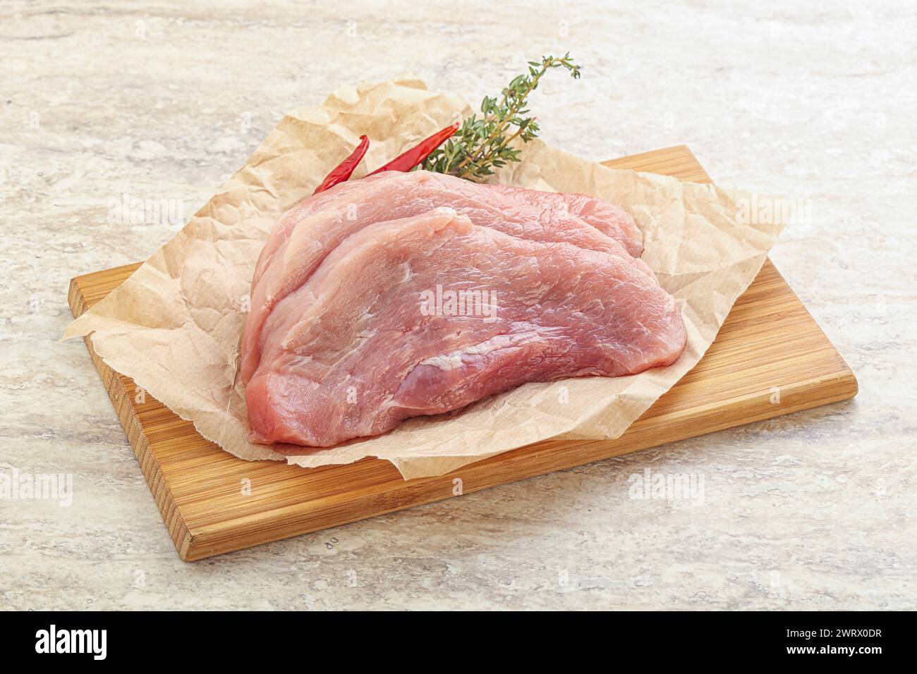 Raw pork schnitzel cut for roast Stock Photo - Alamy