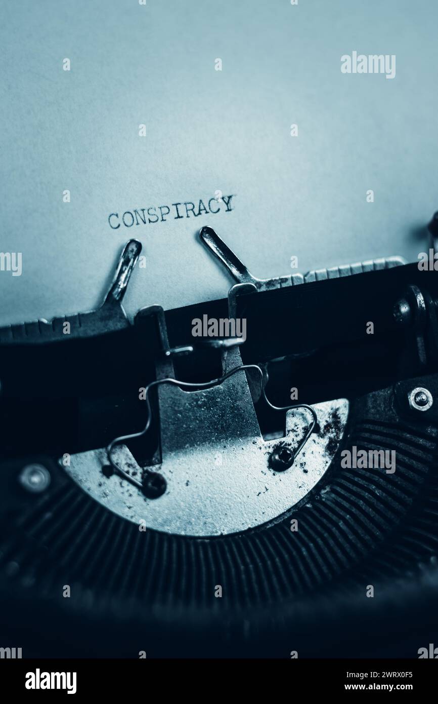 CONSPIRACY typed words on a vintage typewriter. Close up. Antique ...