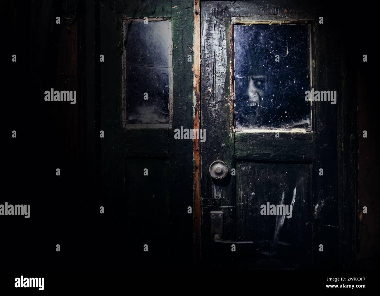 Photo of dusty, abandoned obsolete and shaded door with scary horror ...