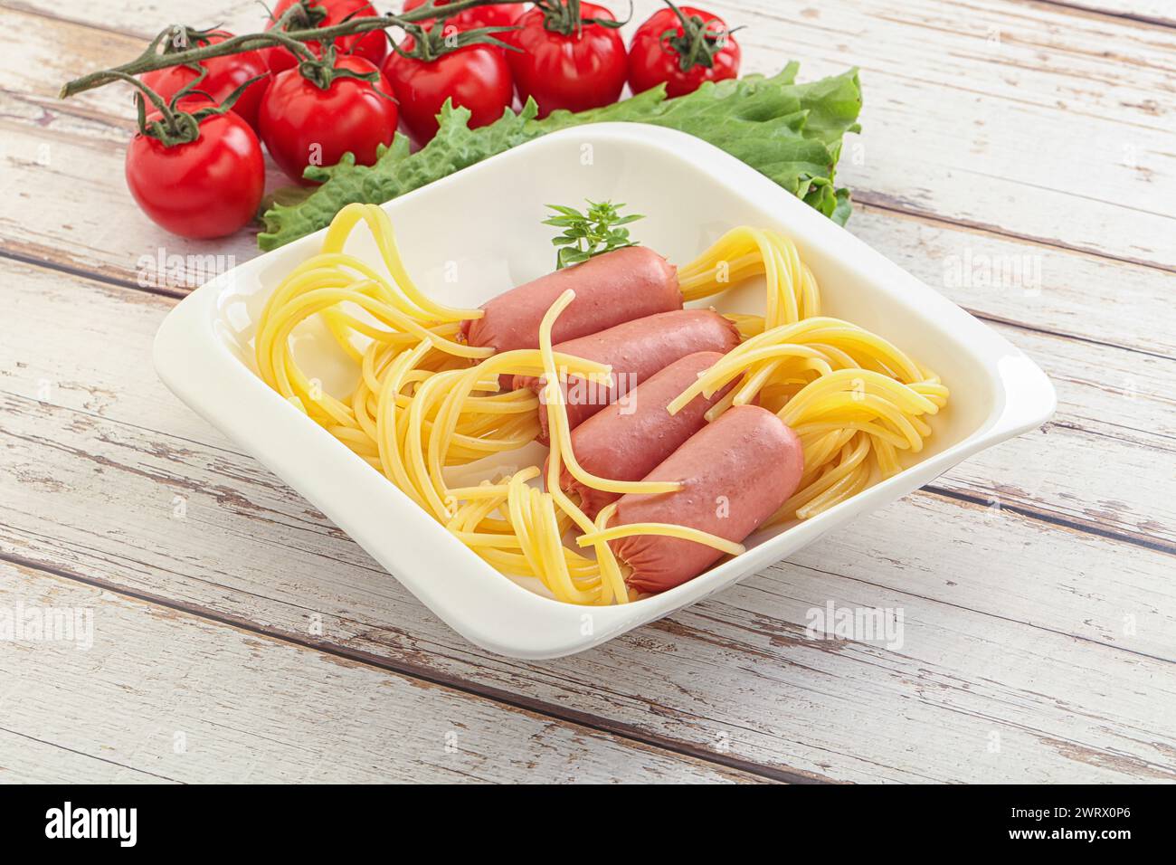 Mini sausages with pasta spaghetti for kids Stock Photo - Alamy