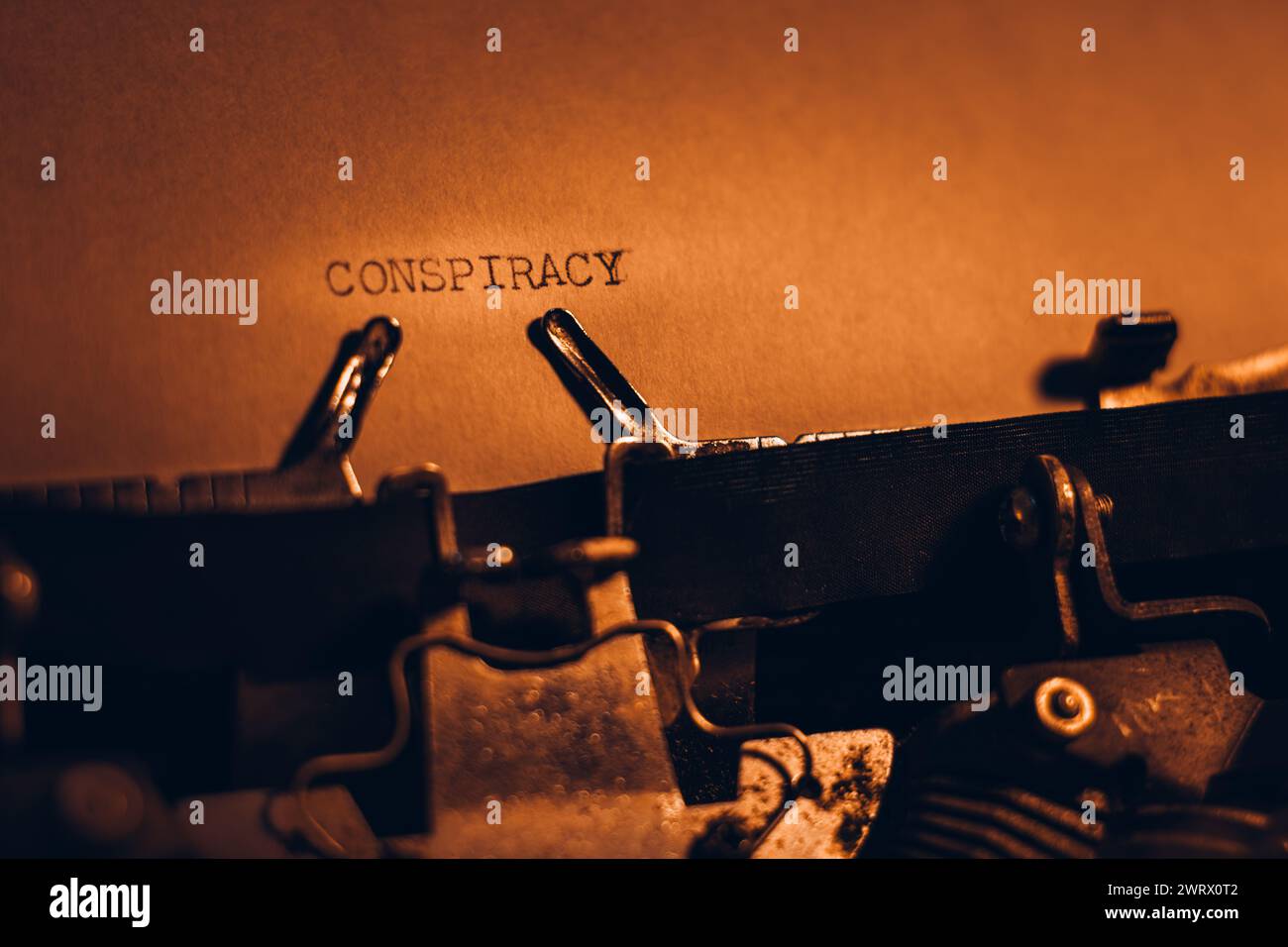 CONSPIRACY typed words on a vintage typewriter. Close up. Antique ...