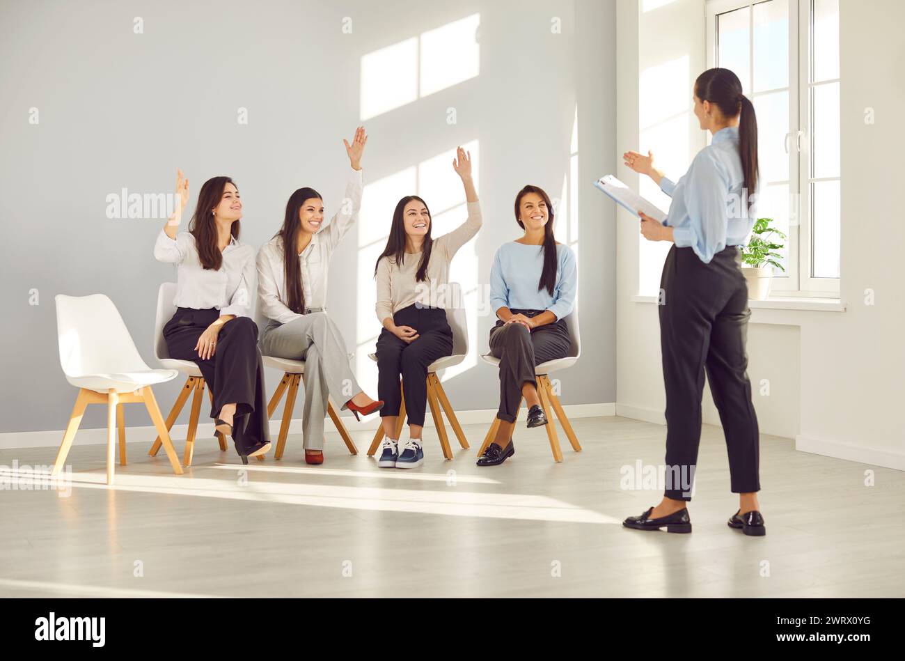 Group of women take active part in women's leadership seminar with ...