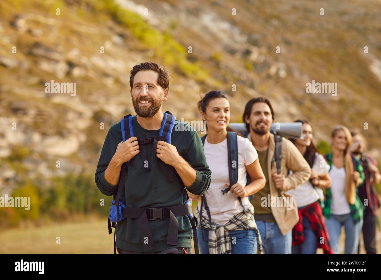 Group of Friends Hiking on Mountain During Vacation Stock Photo - Alamy