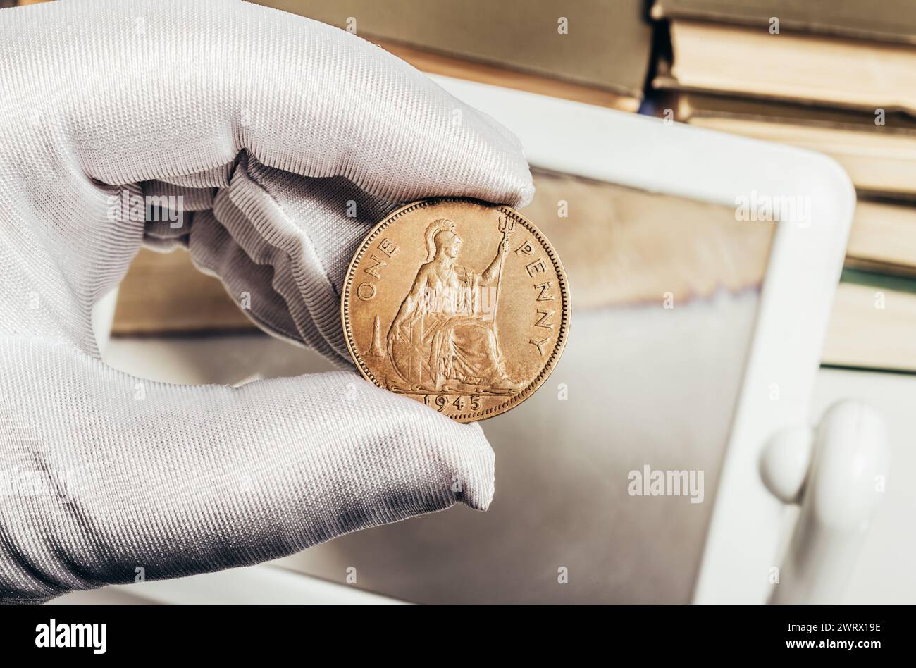 Photo of a person's male hand in white gloves holding a British one ...