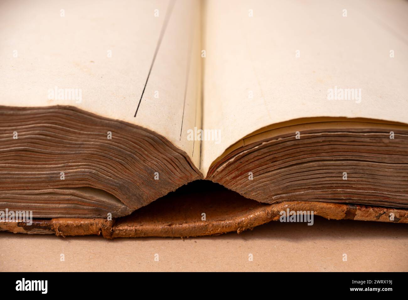 Open books resting on the ground with folded covers Stock Photo - Alamy