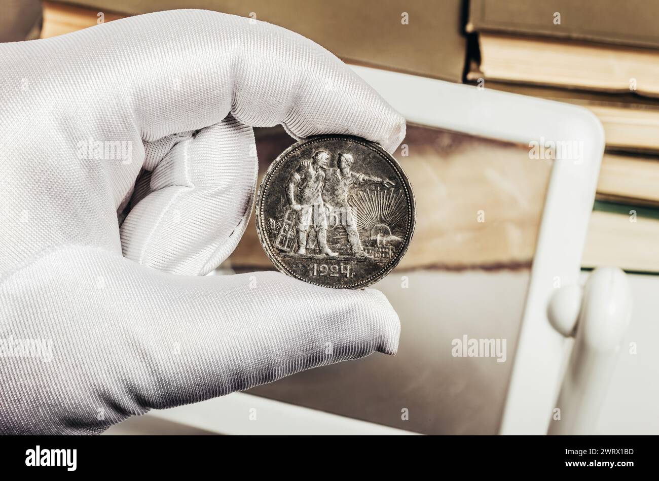 Photo of a person's male hand in white gloves holding a soviet silver ...