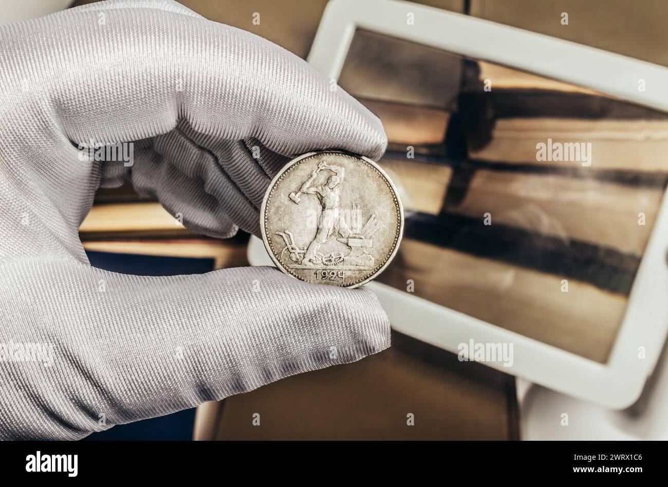 Photo of a person's male hand in white gloves holding a soviet silver ...