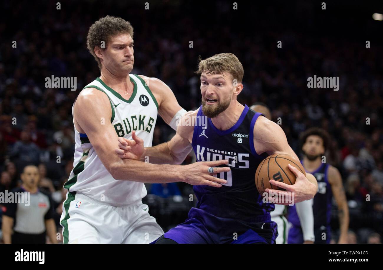 Milwaukee Bucks center Brook Lopez (11) defends Sacramento Kings forward Domantas Sabonis (10 ...