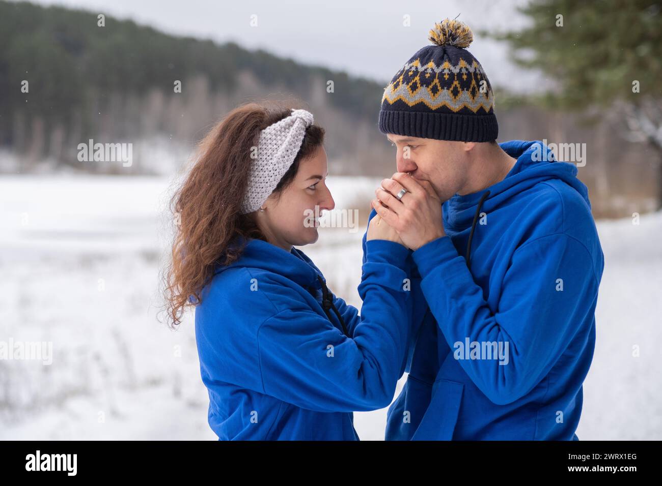 Outdoor happy couple in love posing in cold winter weather Stock Photo ...