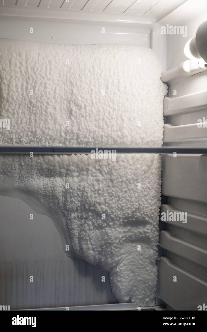 Frozen refrigerator that needs to be defrosted Stock Photo - Alamy