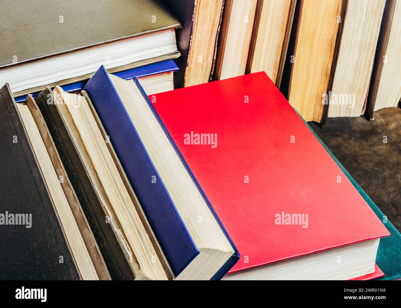 Photo of old antique books laying on leather table surface Stock Photo ...