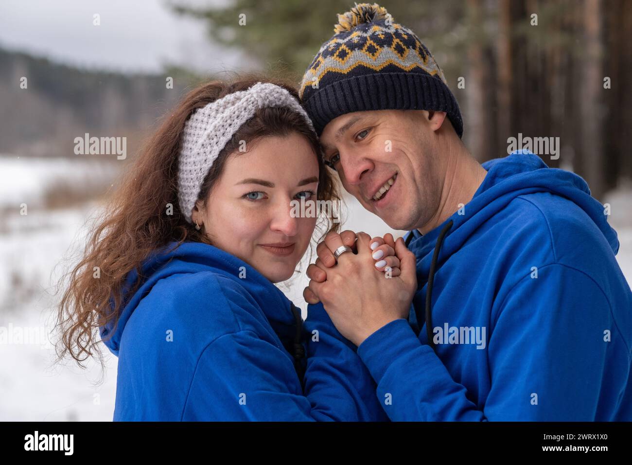Outdoor happy couple in love posing in cold winter weather Stock Photo ...