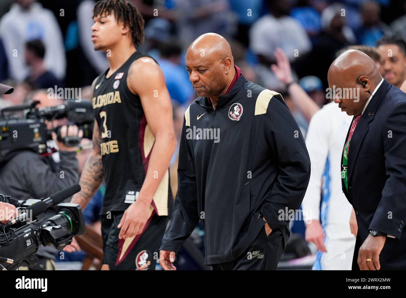 Florida State forward Cam Corhen (3) and head coach Leonard Hamilton ...