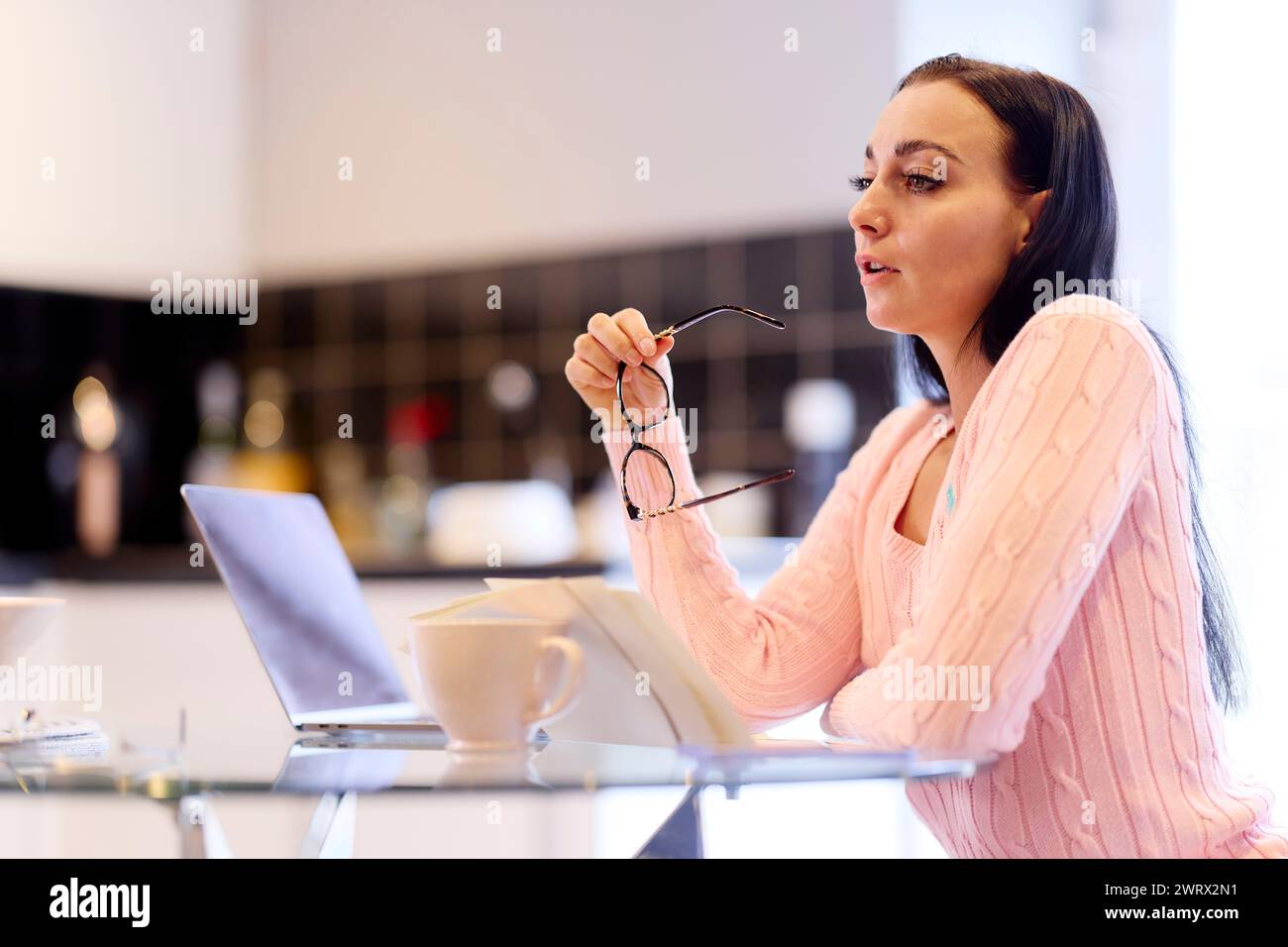 Woman paying bill through hi-res stock photography and images - Alamy