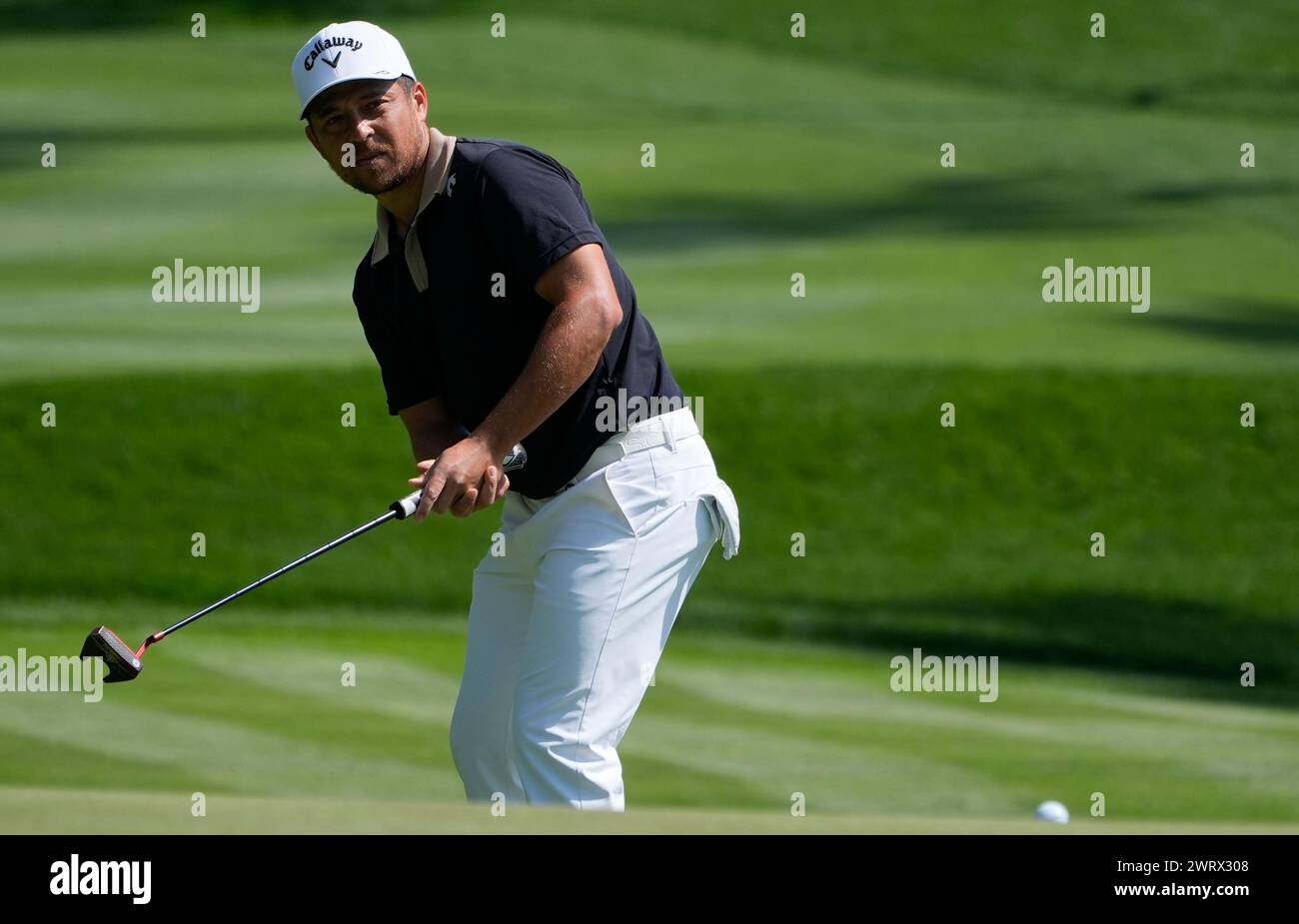 Xander Schauffele putts on the sixth hole during the first round of The ...