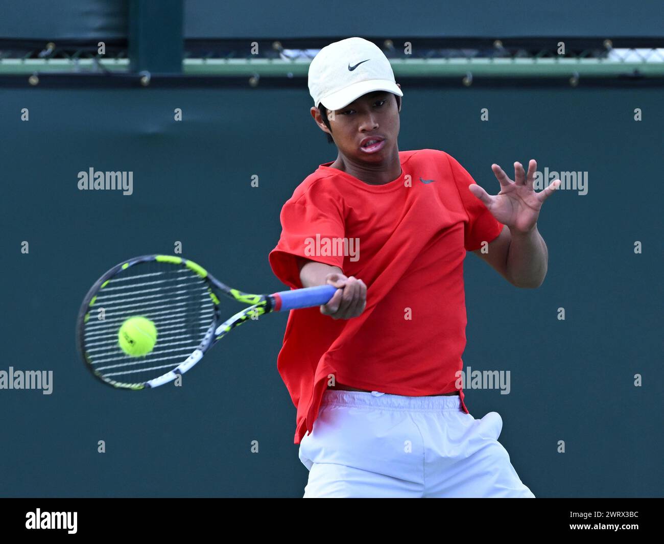 INDIAN WELLS, CA - MARCH 14: Rudy Quan (USA) returns the ball during a ...