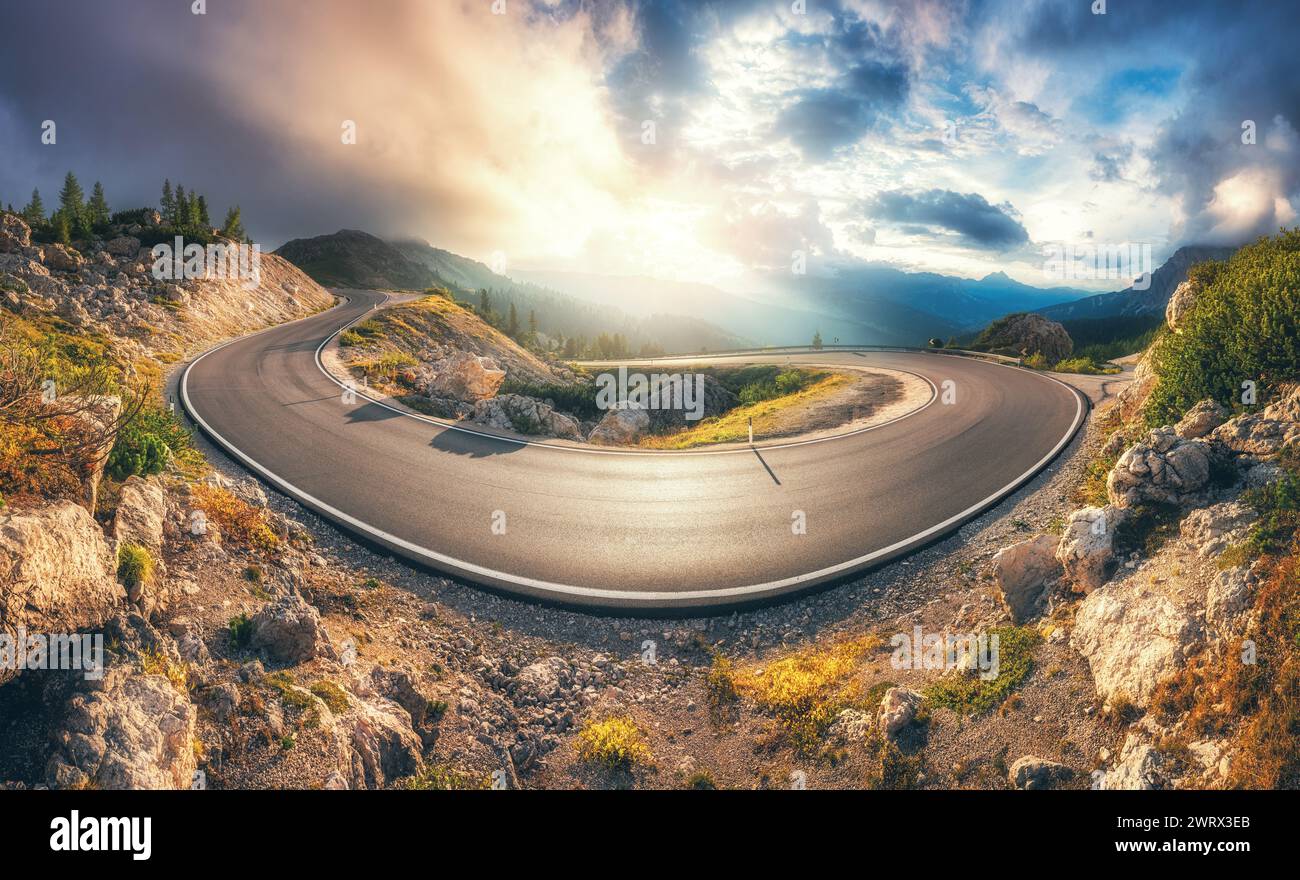 Mountain road at colorful sunset in summer. Curved roadway Stock Photo ...
