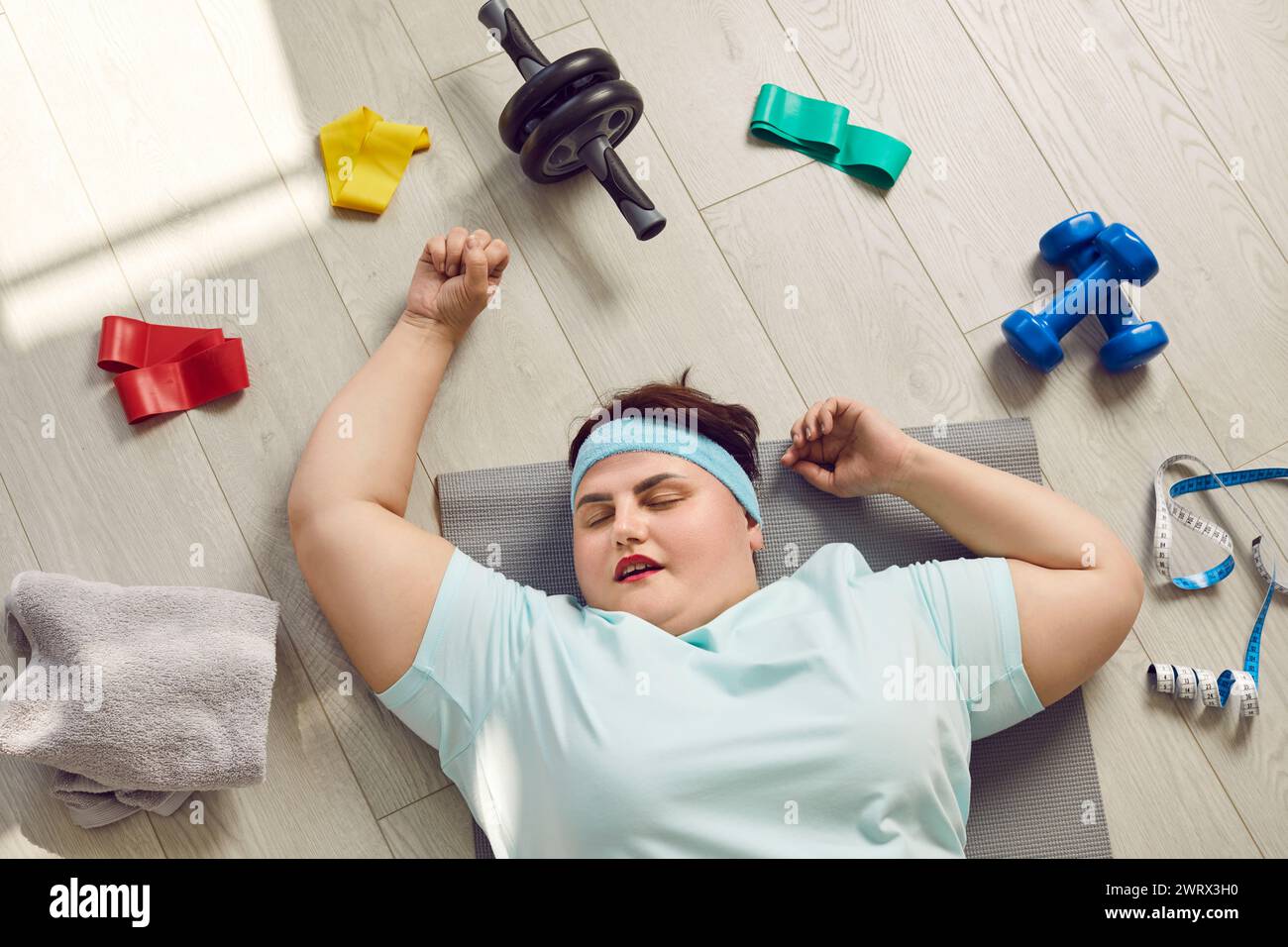 Fat tired after fit exercises woman wearing sportswear lying on the ...