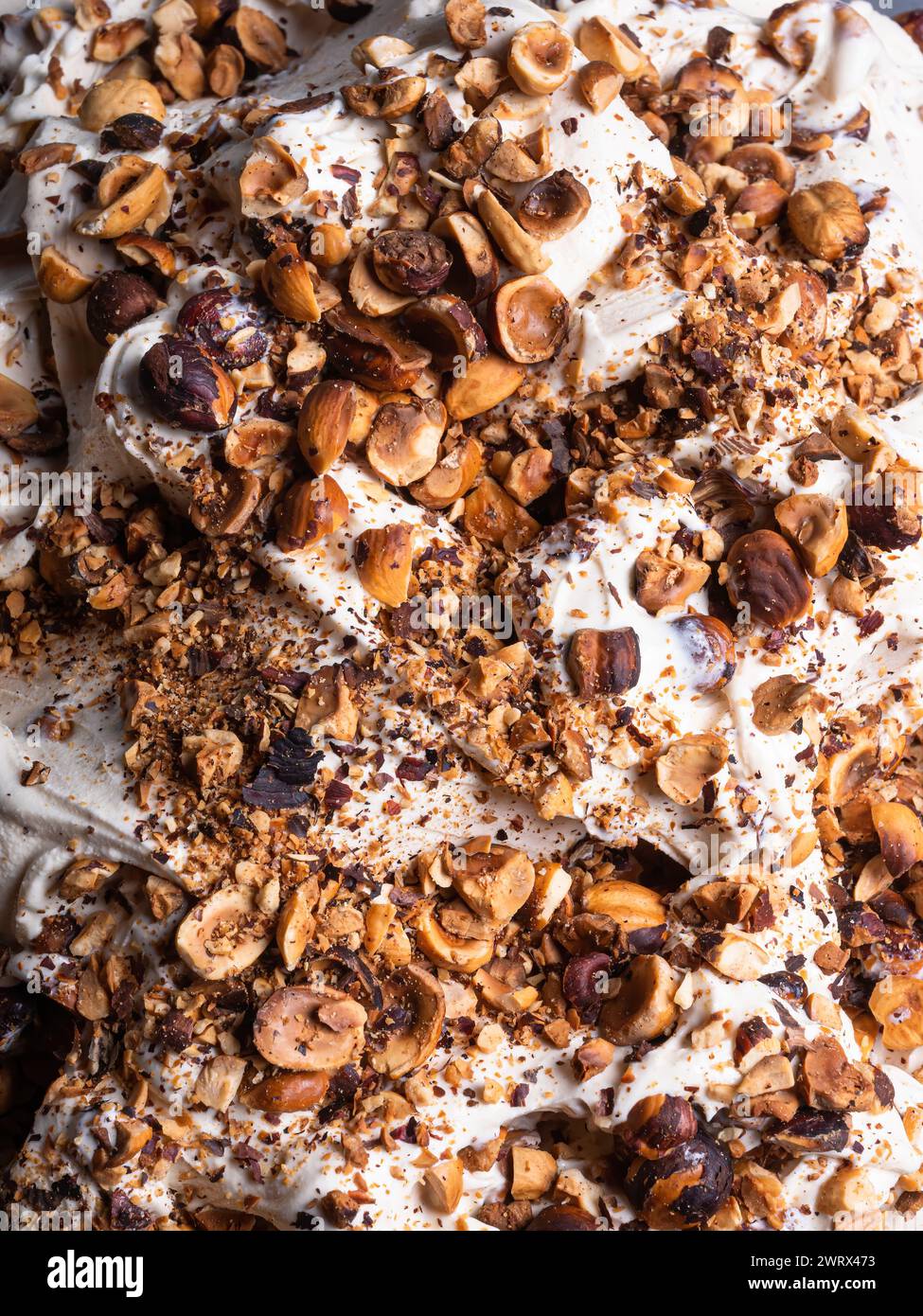 Frozen Hazelnut flavour gelato - full frame detail. Close up of a white ...