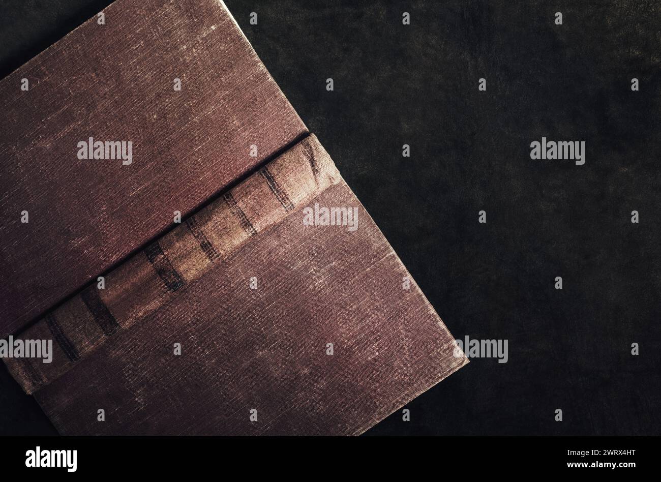 Photo of old antique opened book laying on leather table surface Stock ...