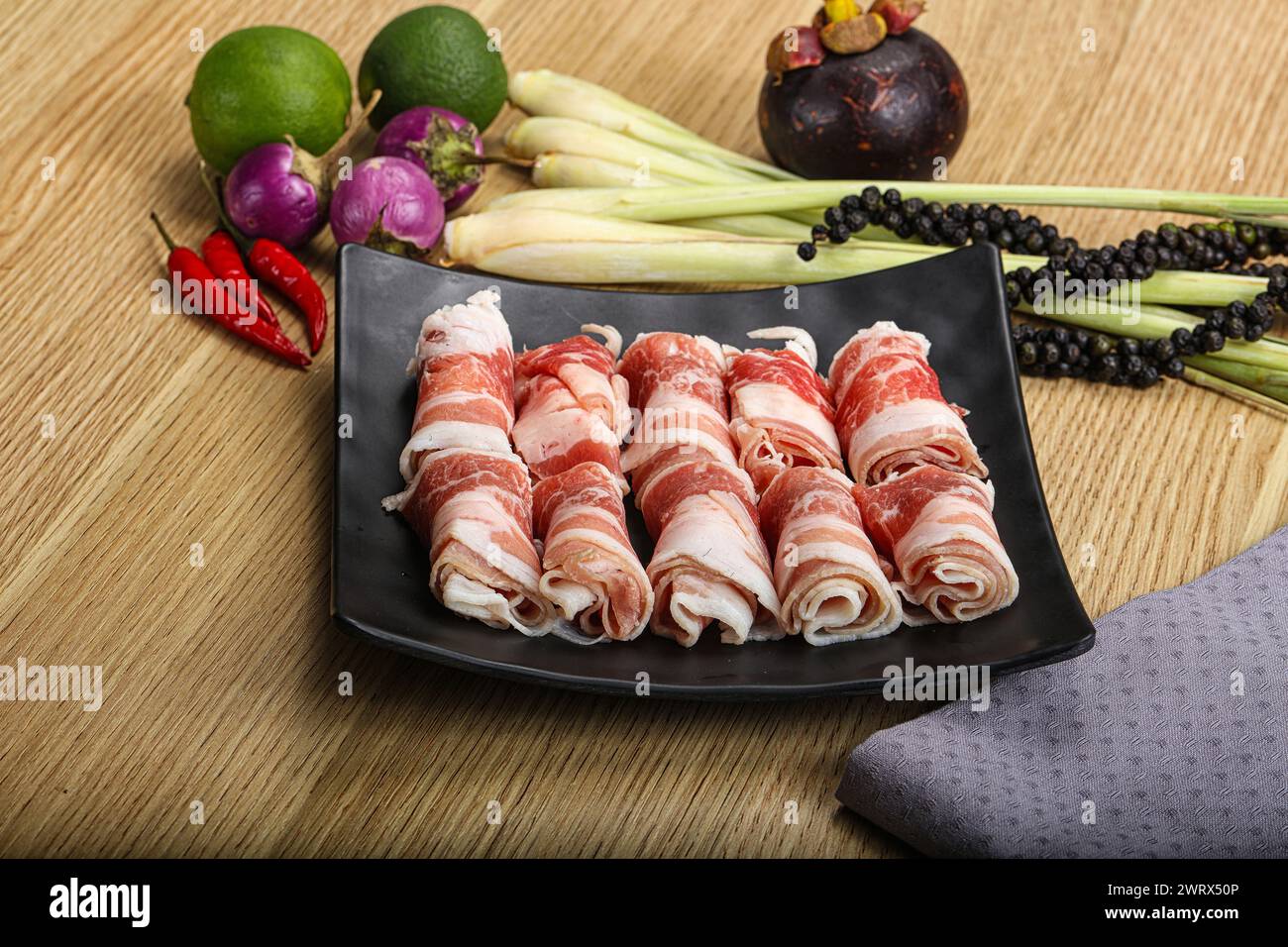Raw beef bacon roll for grill Stock Photo - Alamy