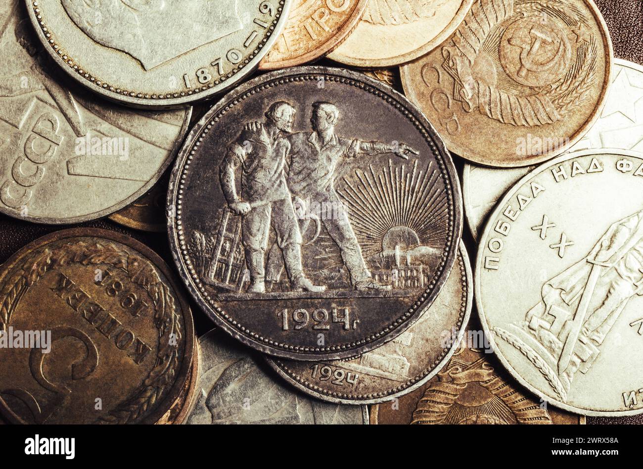 Photo of soviet silver 1924 coin on pile of other various soviet coins ...