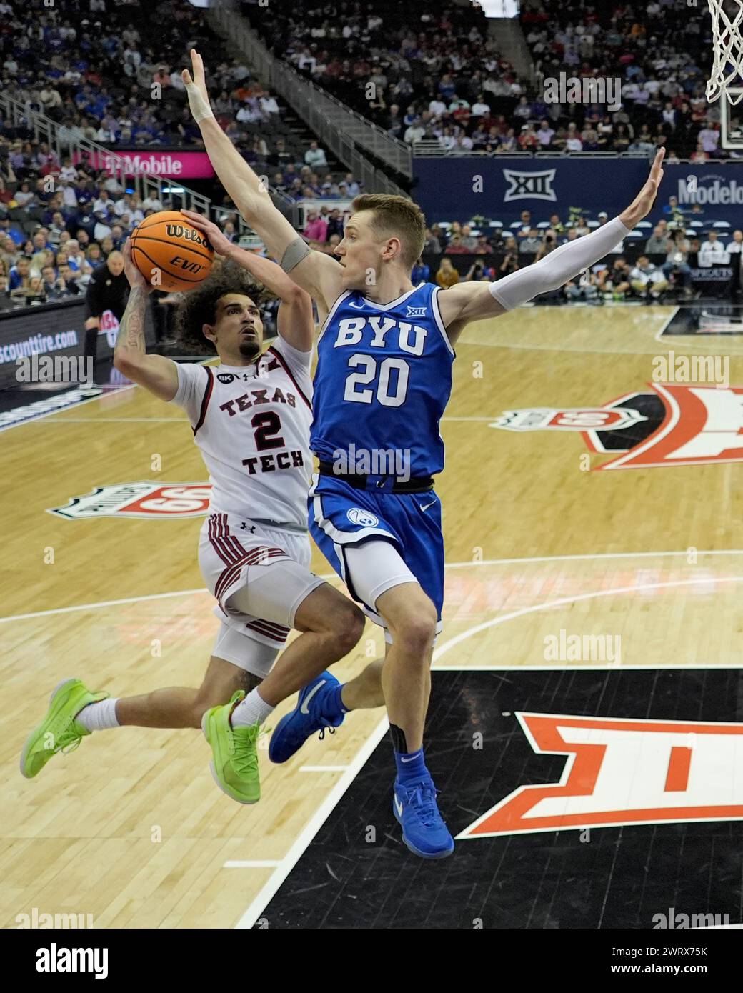 Texas Tech guard Pop Isaacs (2) shoots under pressure from BYU guard ...