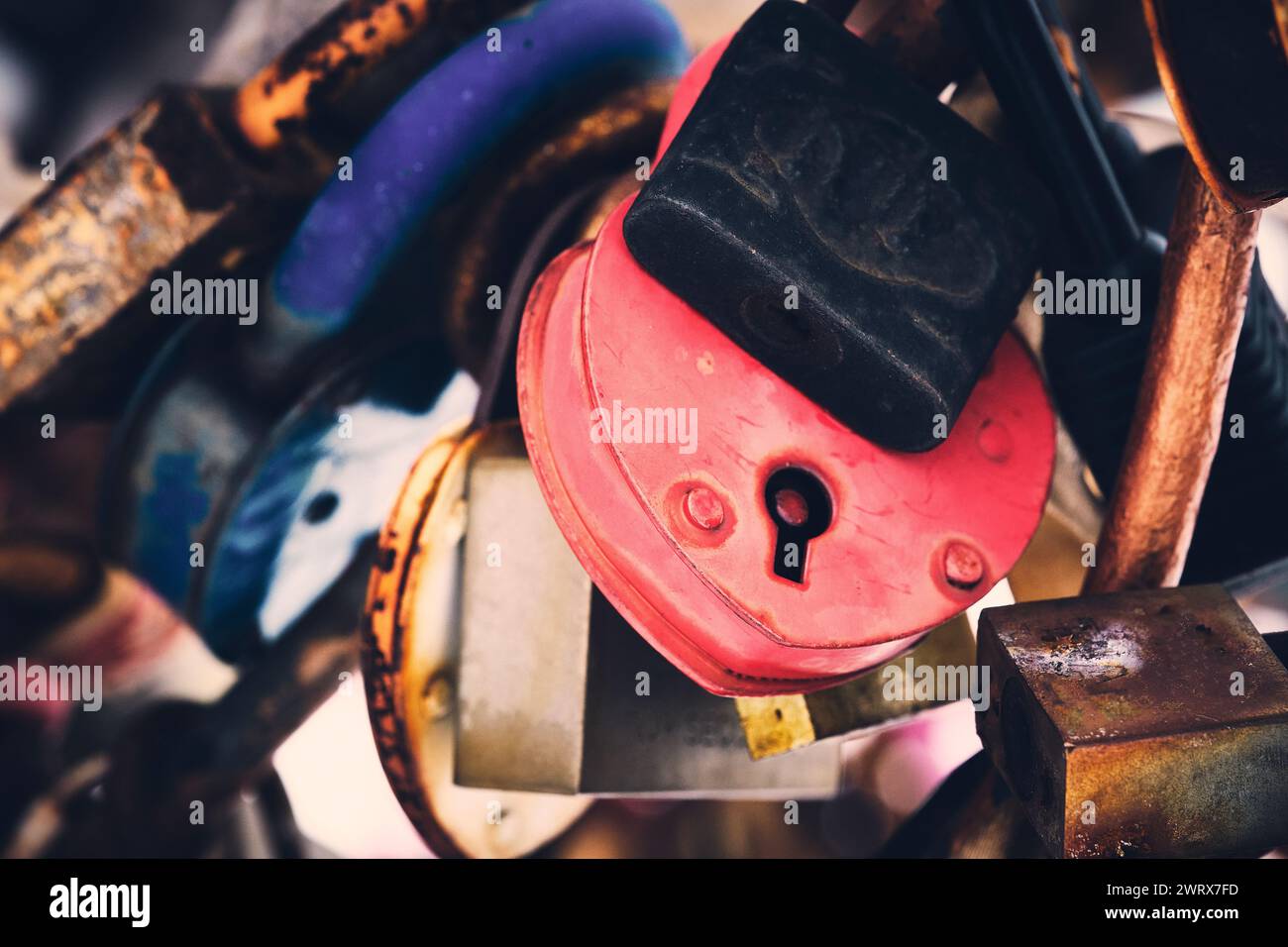 Heart shaped padlock among many old rusty locks Stock Photo - Alamy