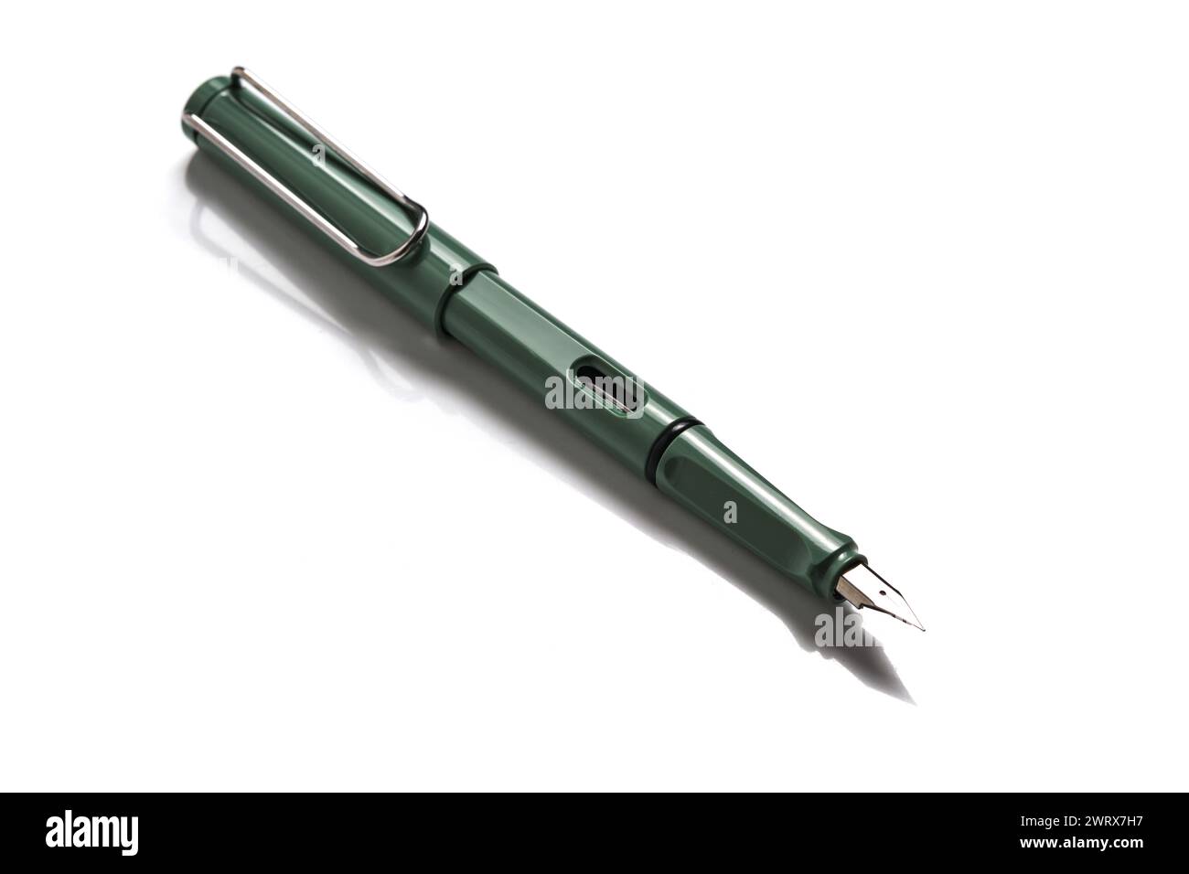 Fountain pen is green on white background Stock Photo - Alamy