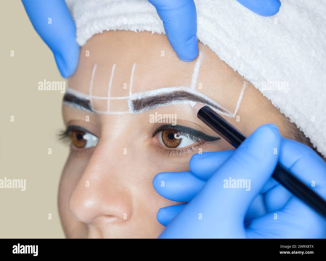 Permanent make-up for eyebrows of beautiful woman with thick brows in ...