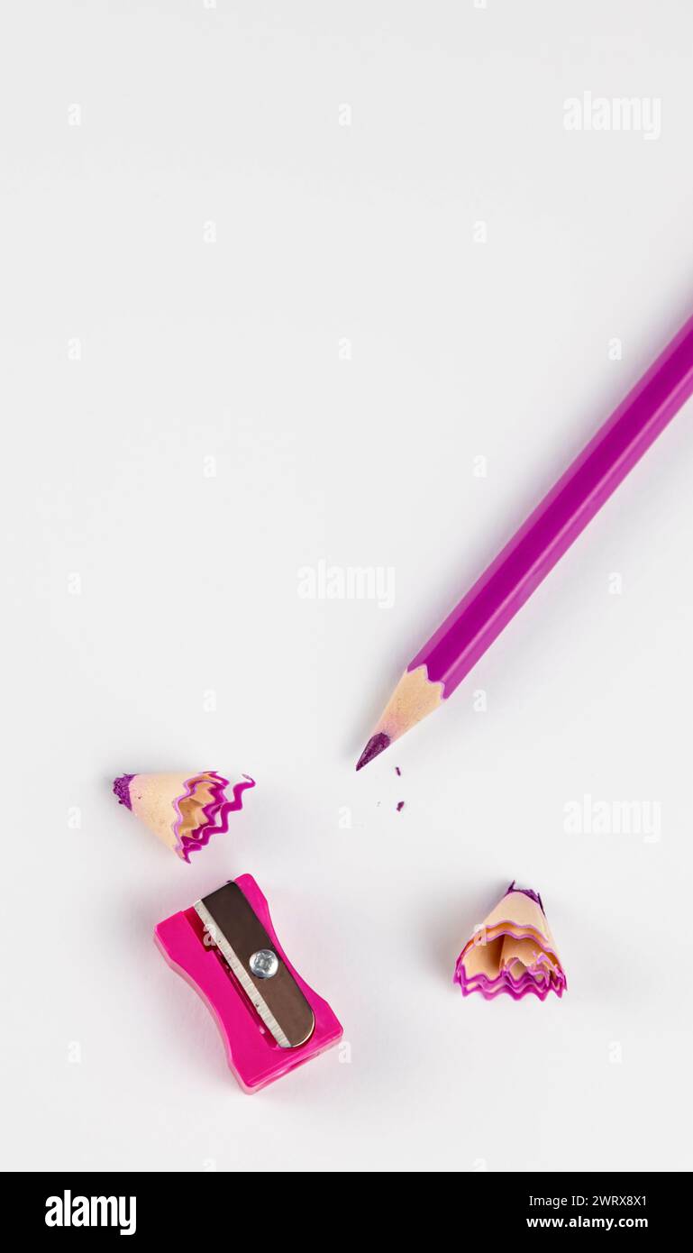 Pencil sharpener, sharpened pink pencil with shavings and sharpener ...