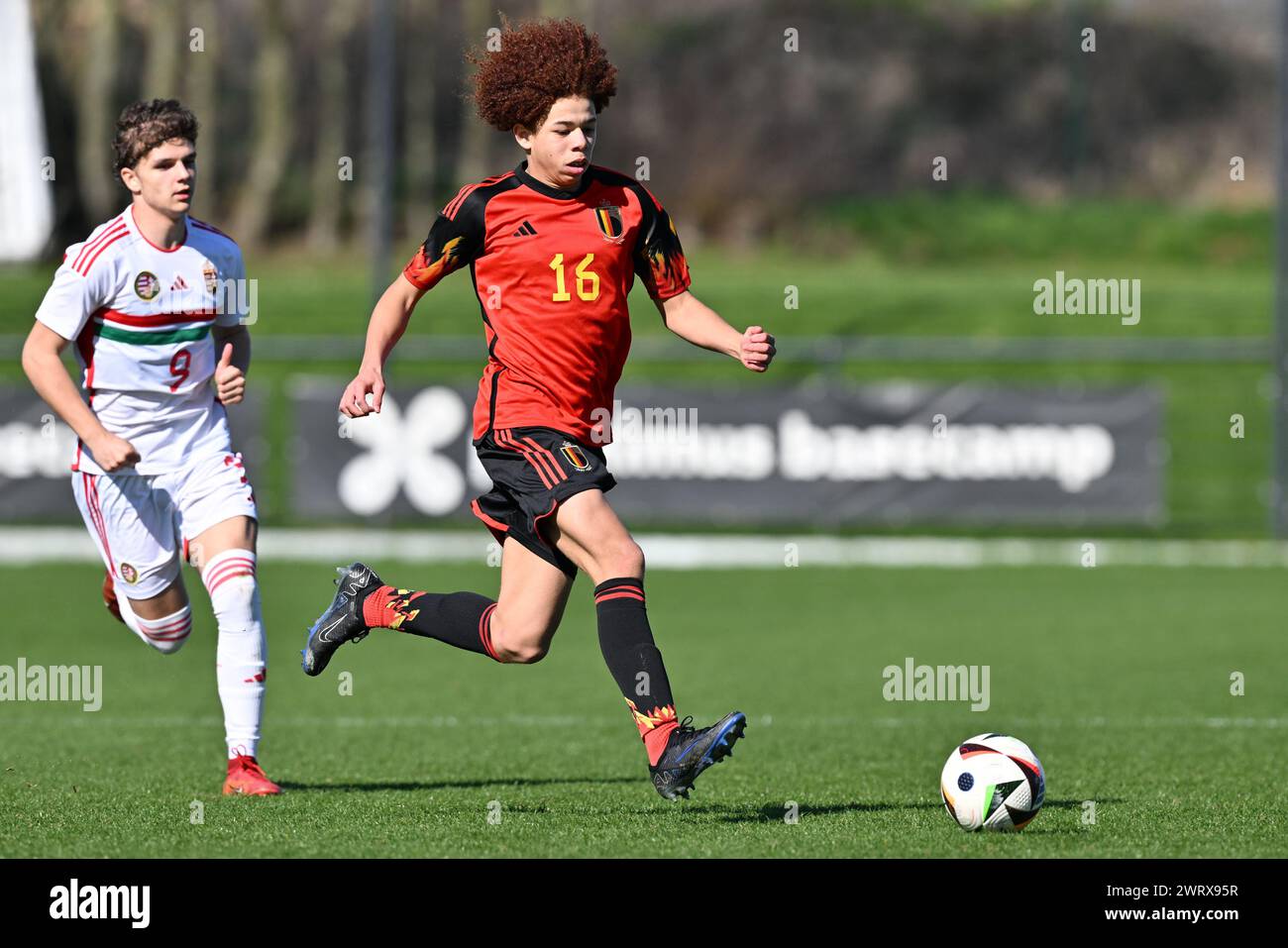 Benjamin Golik (9) of Hungary pictured defending on Aaron Ibrahim (16 ...