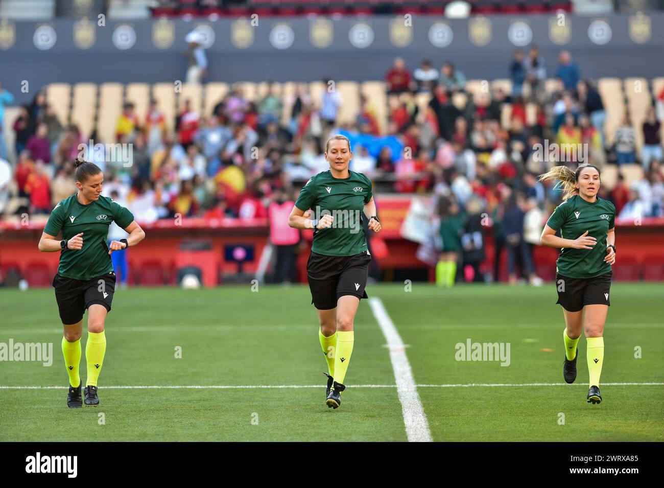 Referees pictured warming up before a female football game between ...