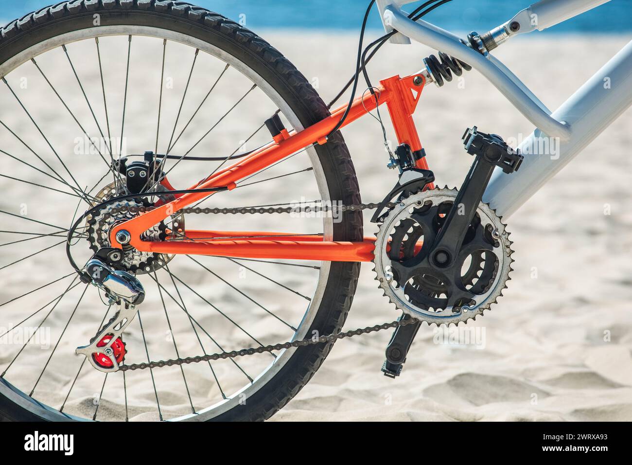The back of the bicycle, the wheel frame and the pedals are visible ...