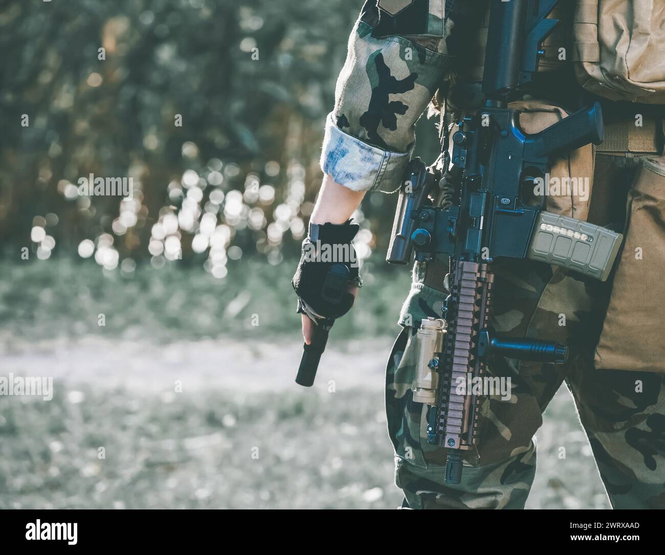 The soldier in the performance of tasks in camouflage and protective ...