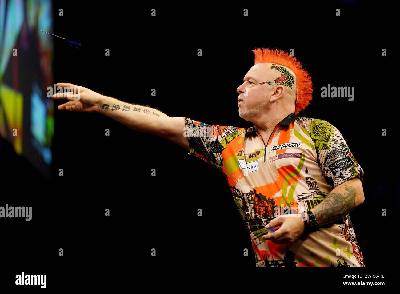 Peter Wright in action against Gerwyn Price (not pictured) on night ...