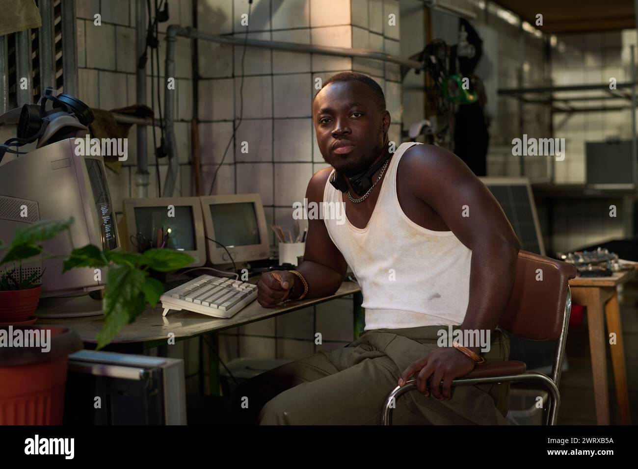 Medium portrait of young African American programmer wearing dirty ...