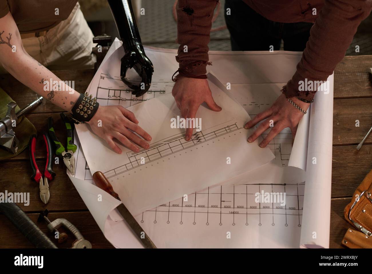 From above view shot of unrecognizable male and female technicians ...