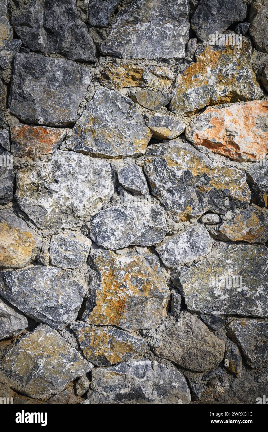 Stone wall texture background - grey stone siding with different sized ...