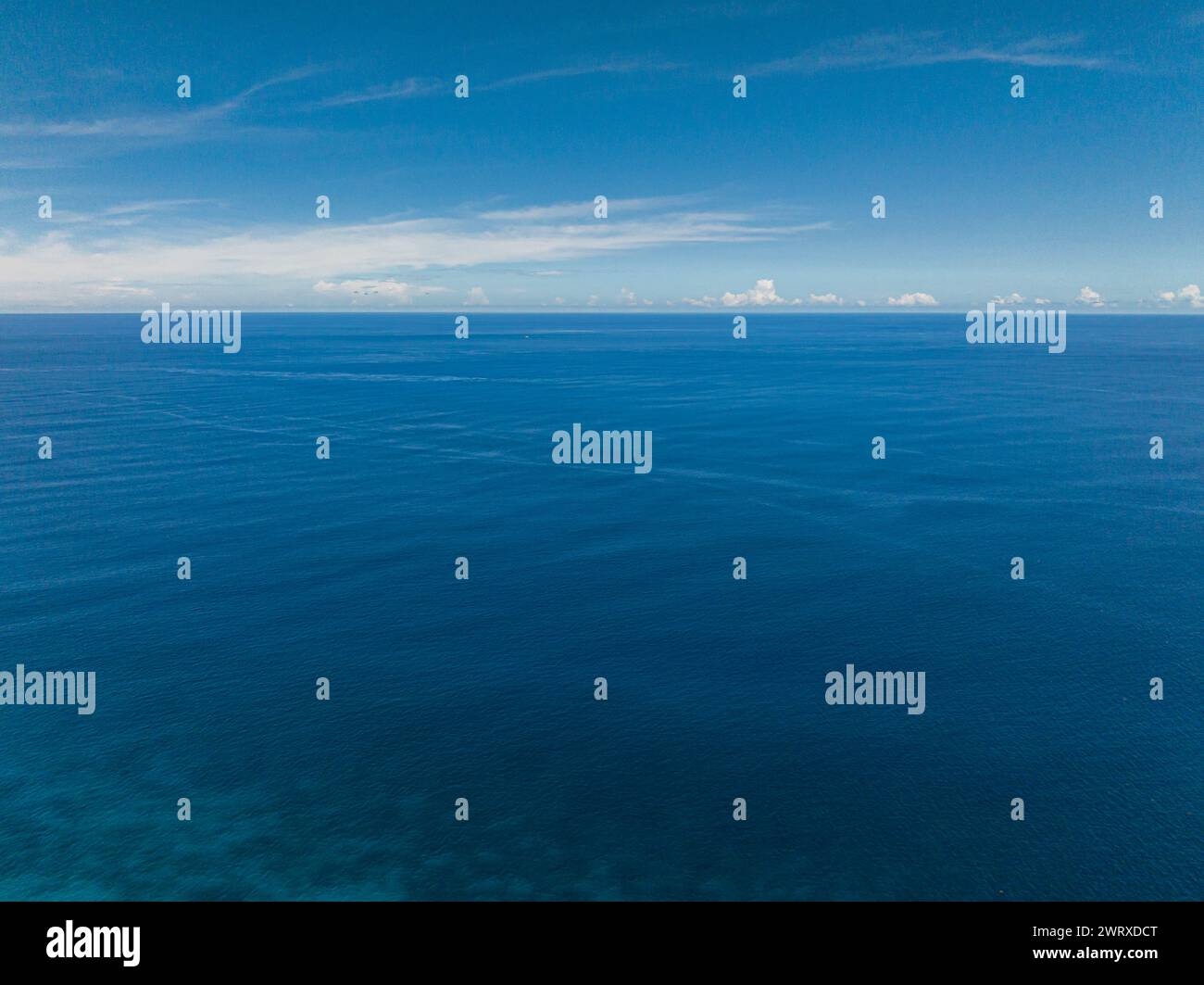 Beautiful deep blue sea and sky with clouds, seascape. Mindanao ...