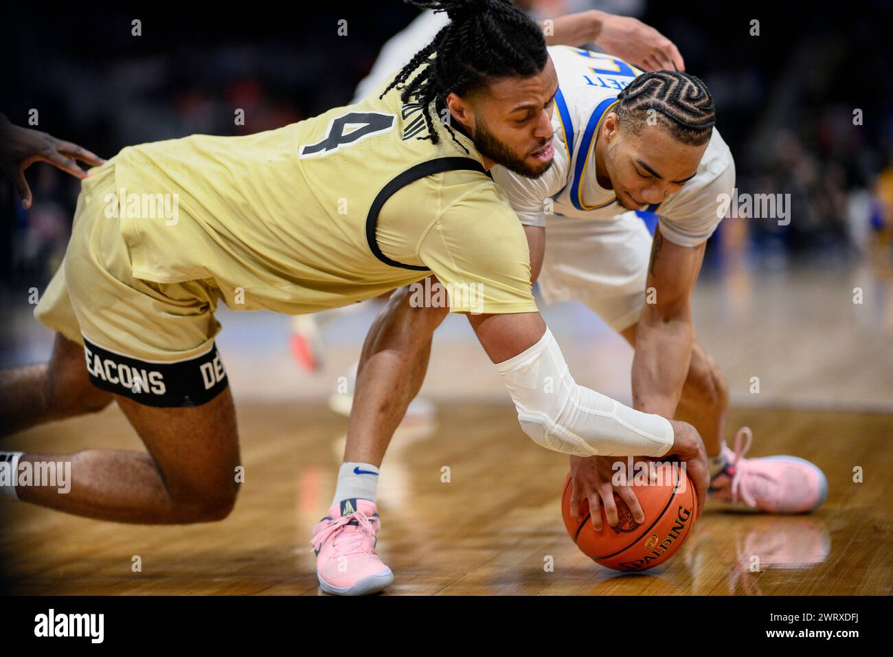 Wake Forest forward Efton Reid III (4) and Pittsburgh guard Ishmael ...