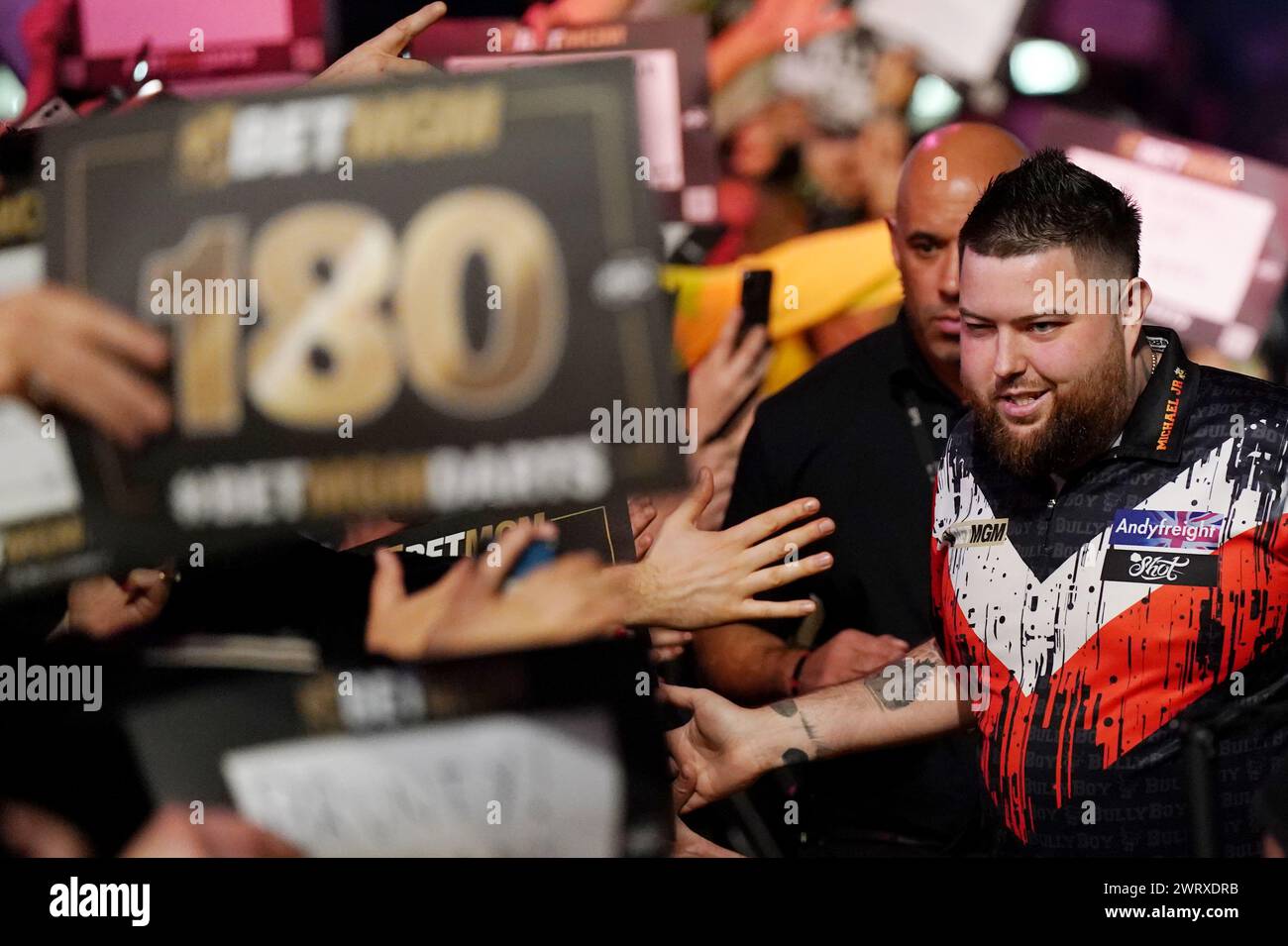 Michael Smith walks out to play Luke Humphries (not pictured) on night ...