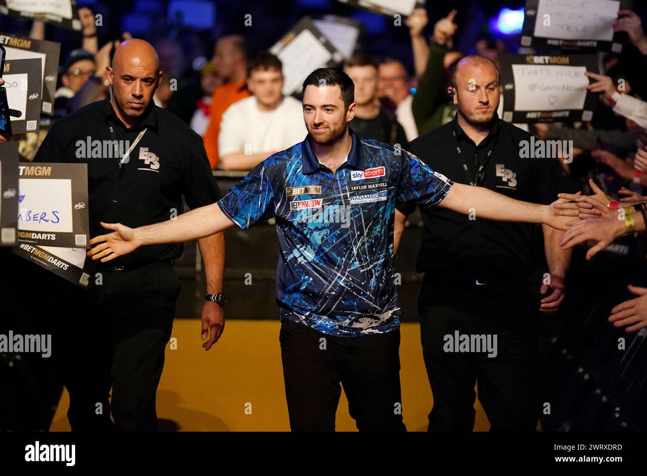 Luke Humphries walks out to play Michael Smith (not pictured) on night ...
