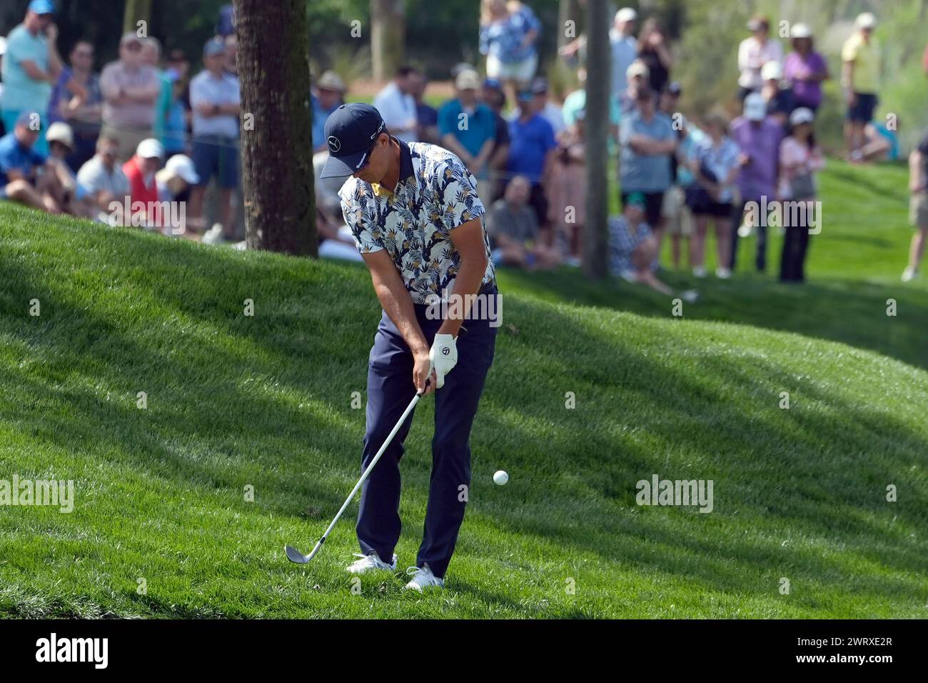 Rickie Fowler chips on the fifth hole during the first round of The ...