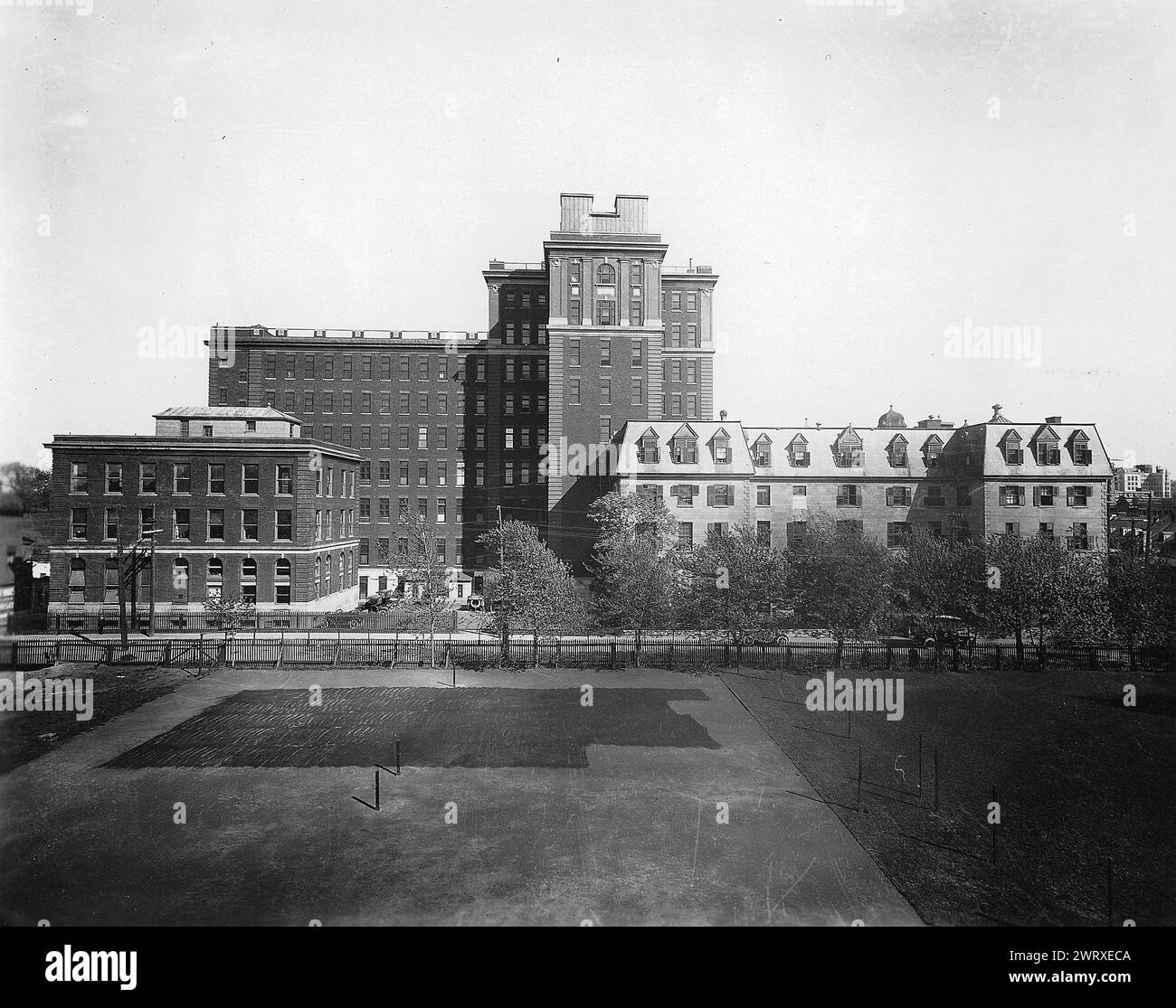 Historic black and white photo of an old building with adjacent ...