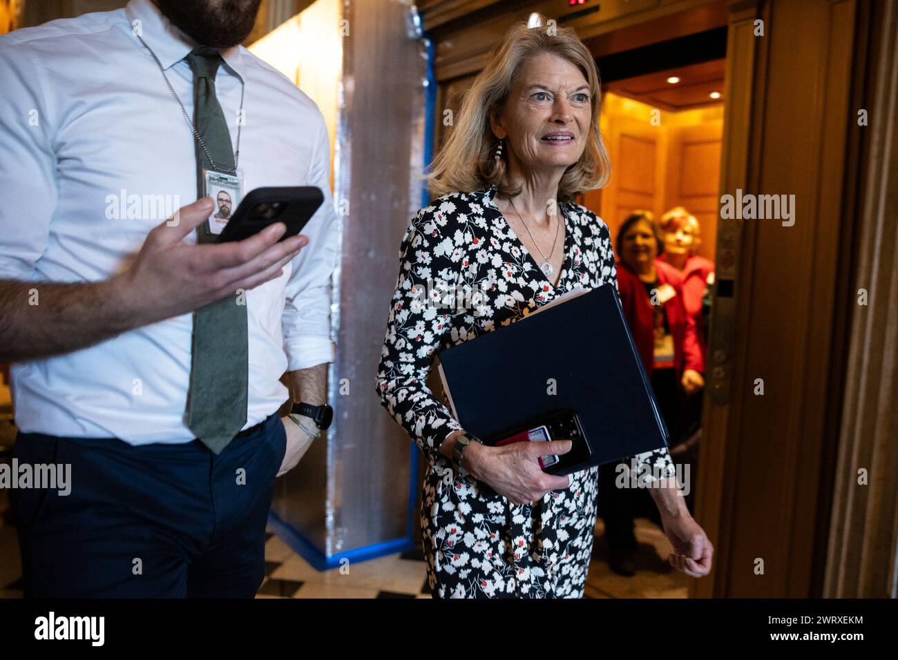 Sen. Lisa Murkowski (R-Alaska) speaks with reporters as she departs a ...