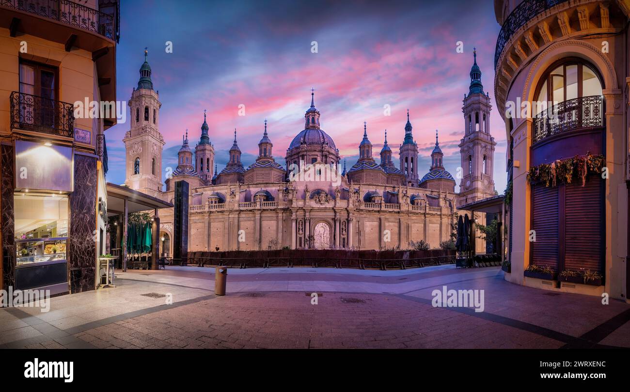 Street view of the city of Zaragoza, Spain. The building at the end of ...