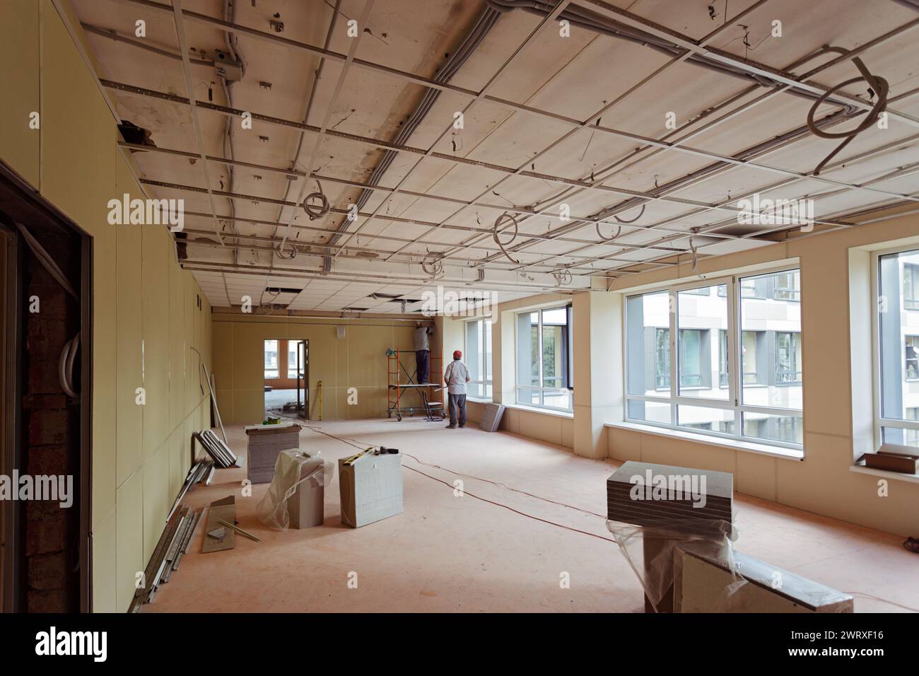 Electrical cable laying on ceiling. Concept installation of utilities ...