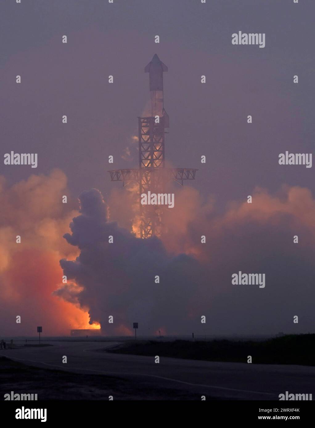 SpaceX's mega rocket Starship launches at dawn in the haze on it's ...