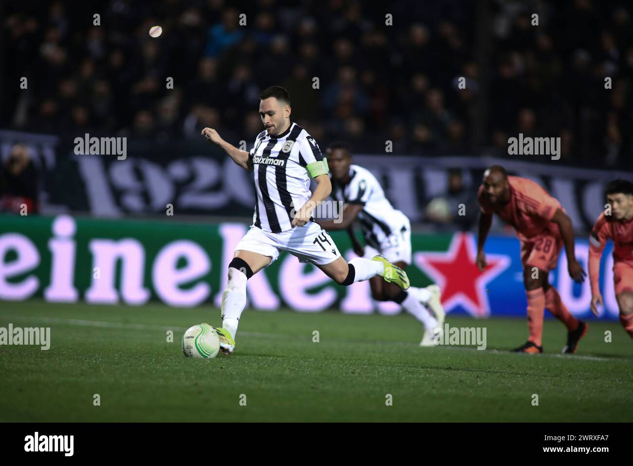 PAOK's Andrija Zivkovic kick a penalty to scores the fifth goal of his ...